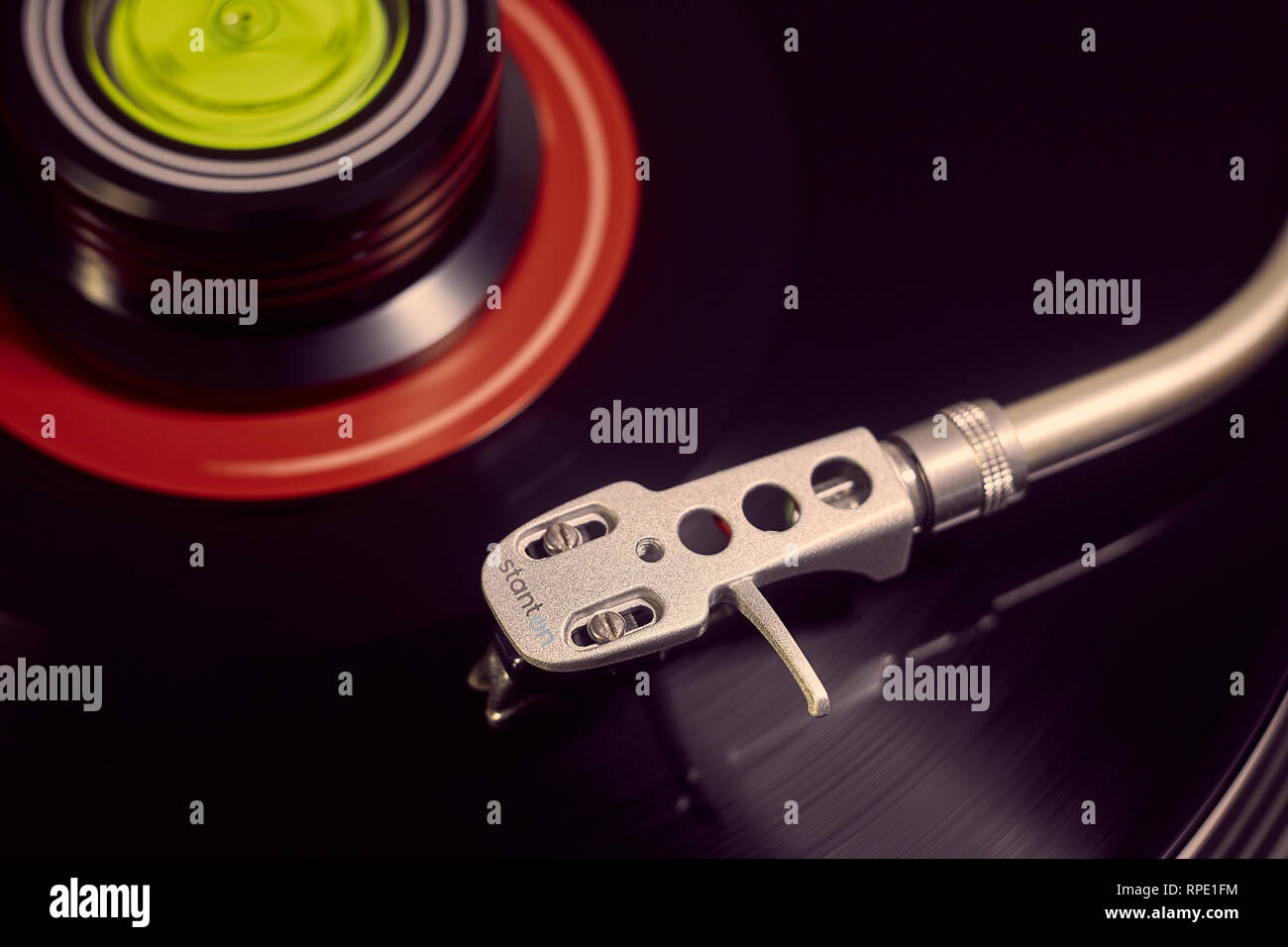 Rotating vinyl record with a weight and the stylus lowered Stock Photo ...