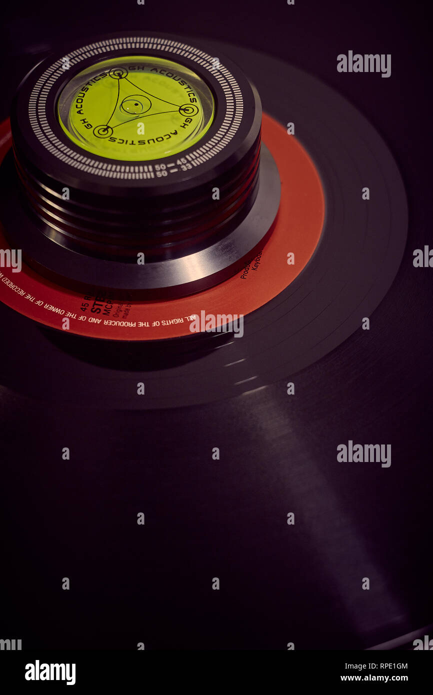 Vertical background of a stationary record and weight with a diagonal ...