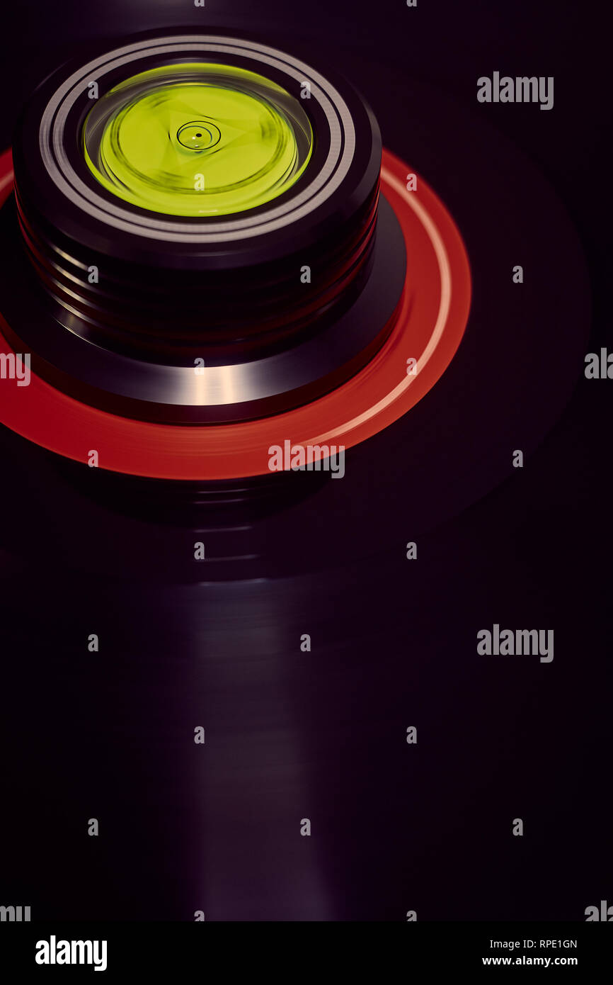 Vertical background of a rotating record and weight with a diagonal ...