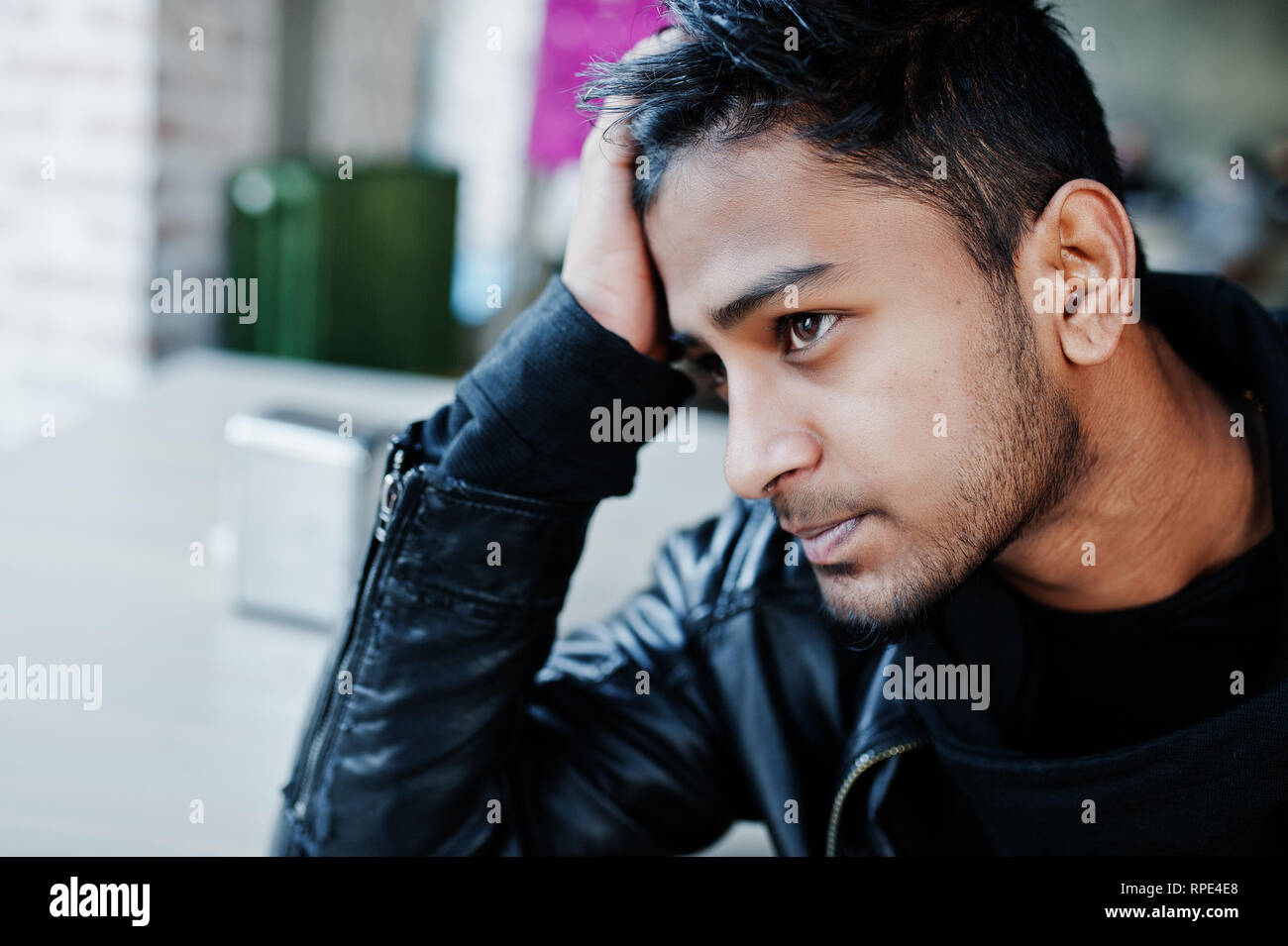 Close up portrait of smart young asian man wear on leather jacket ...