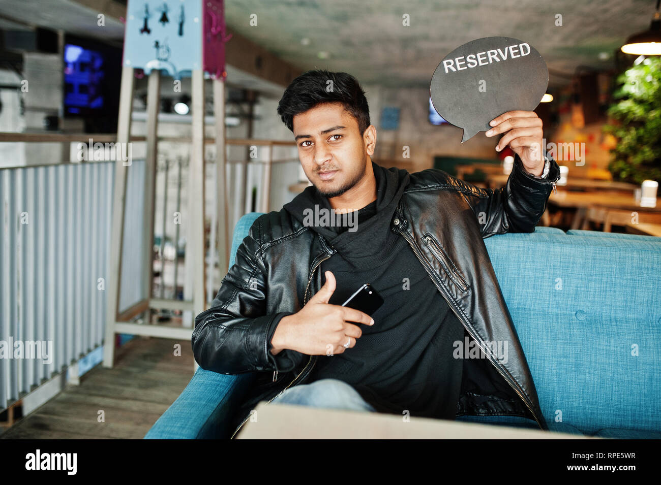 Casual and stylish young asian man wear on leather jacket sitting at ...