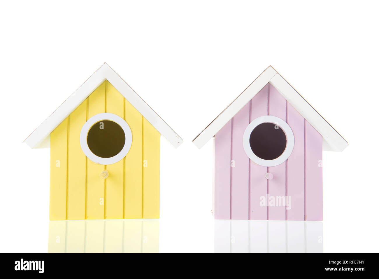 Many colorful bird boxes isolated over white background Stock Photo - Alamy