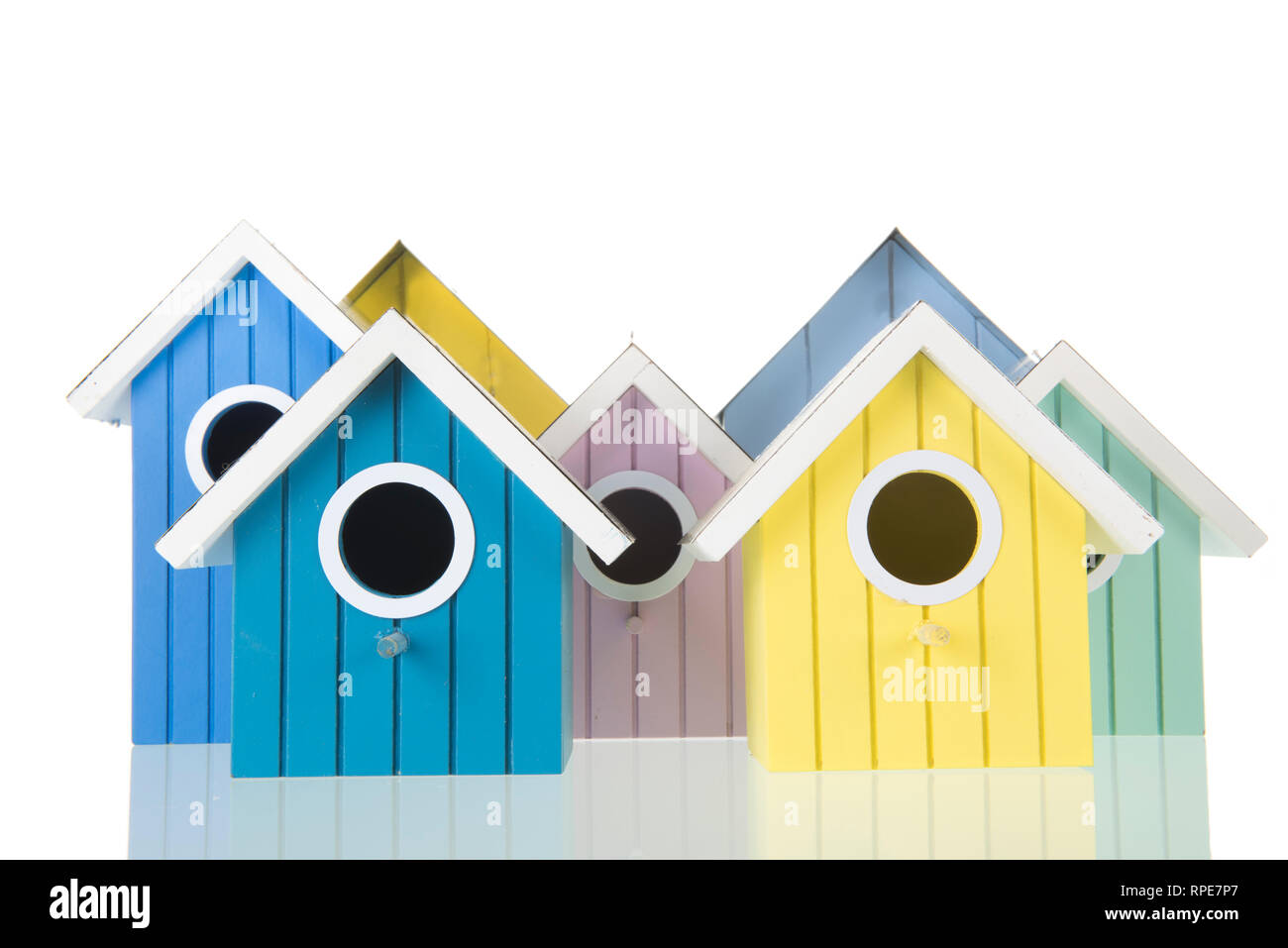 Many colorful bird boxes isolated over white background Stock Photo - Alamy