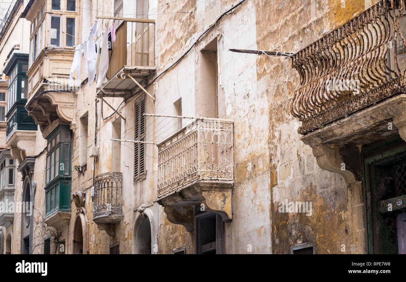 House facade with old, ancient and rusty balcony on Republic Street in ...