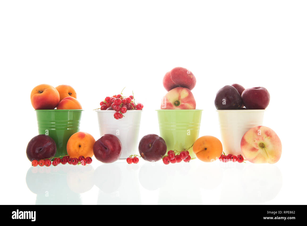 Green bucket full with fresh fruit isolated over white background Stock ...