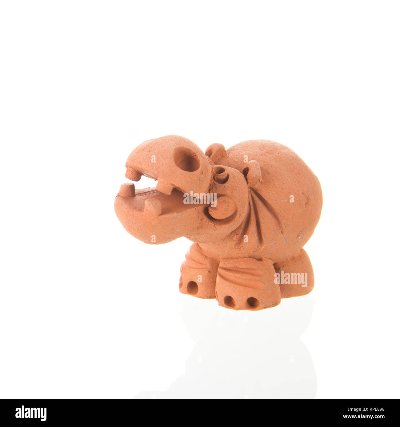 Single funny hippo from clay isolated over white background Stock Photo ...