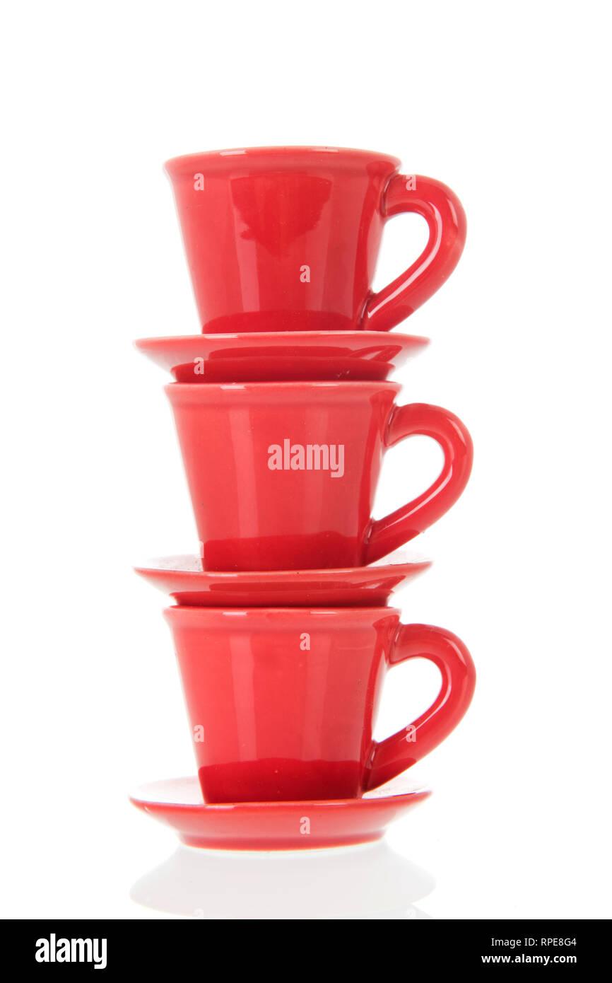 Stacked red cups and saucers isolated over white background Stock Photo ...