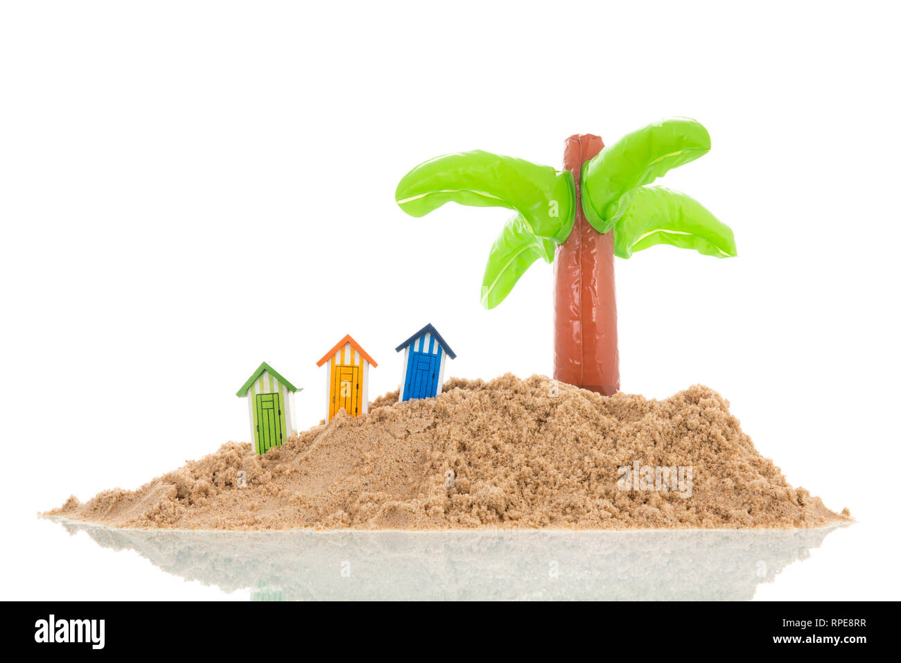 Island with inflatable palm tree and heap of sand isolated over white ...
