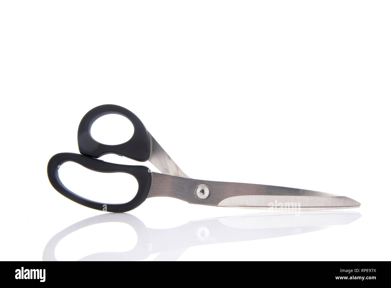 Closed black scissors isolated over white background Stock Photo - Alamy