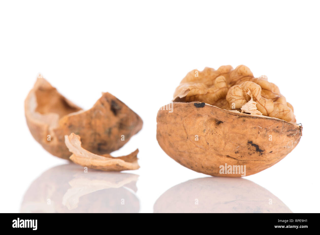 Cracked walnut isolated over white background Stock Photo - Alamy