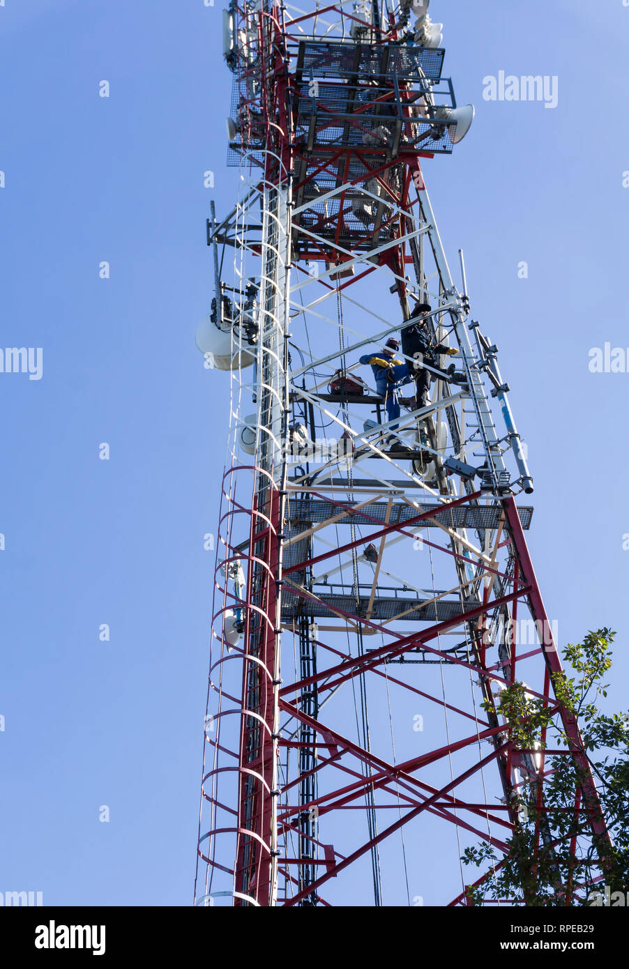 Two Welders Working On High Telecommunication Tower Stock Photo - Alamy