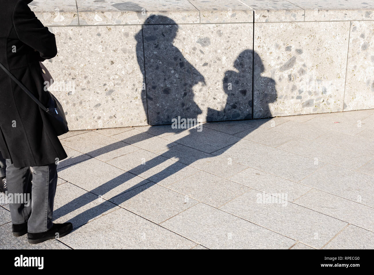 picture of the shadows of two women on a wall Stock Photo - Alamy