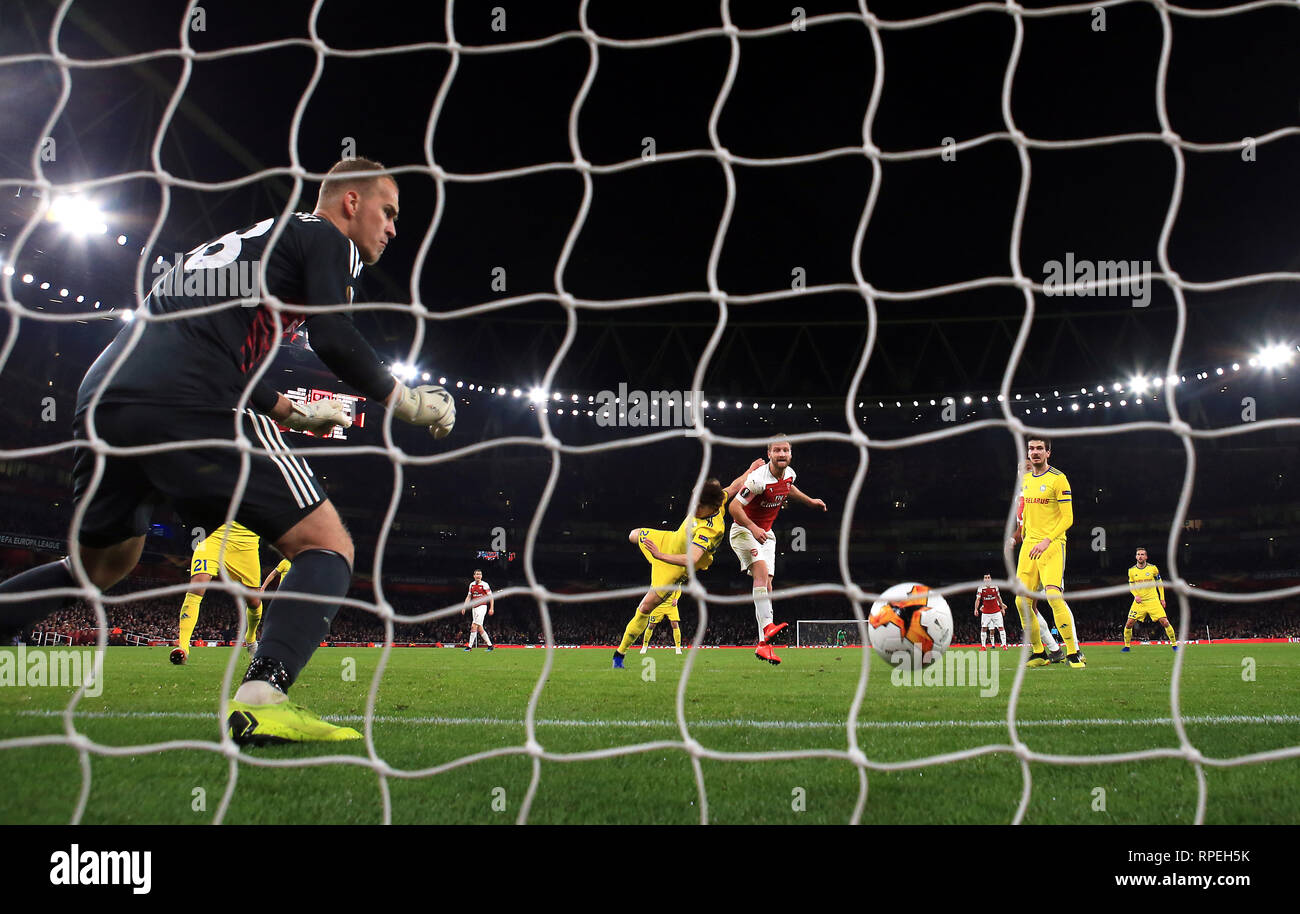 Arsenal's Shkodran Mustafi (centre) scores his side's second goal of ...