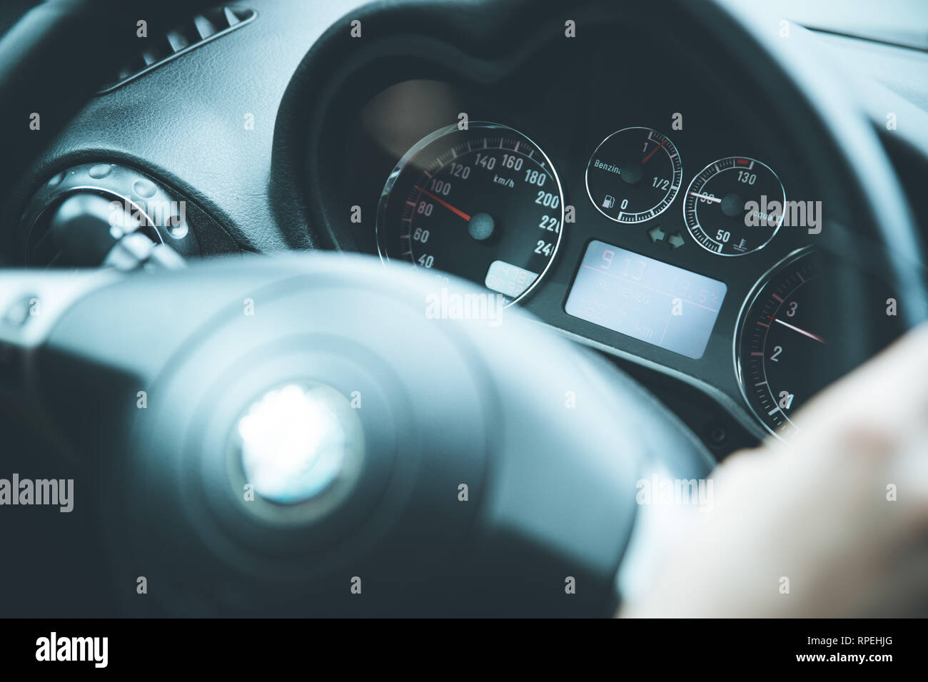 Sports car dashboard and steering wheel with tachometer and fuel ...