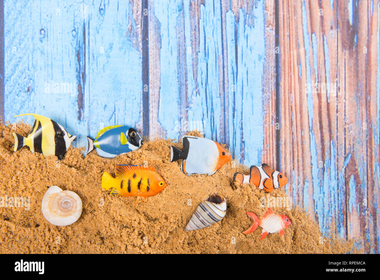 Plastic fishes in sand at the beach Stock Photo - Alamy