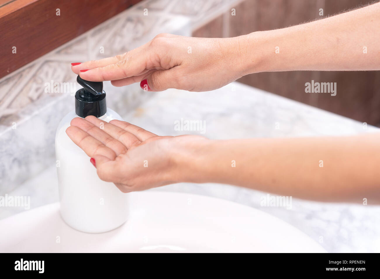 Woman liquid cleaner dispenser hi-res stock photography and images - Alamy