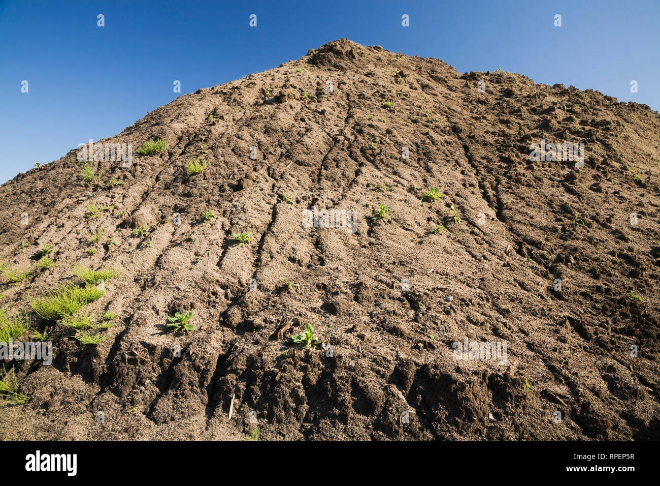 Mound of sand after a heavy rainfall in a commercial sandpit Stock ...