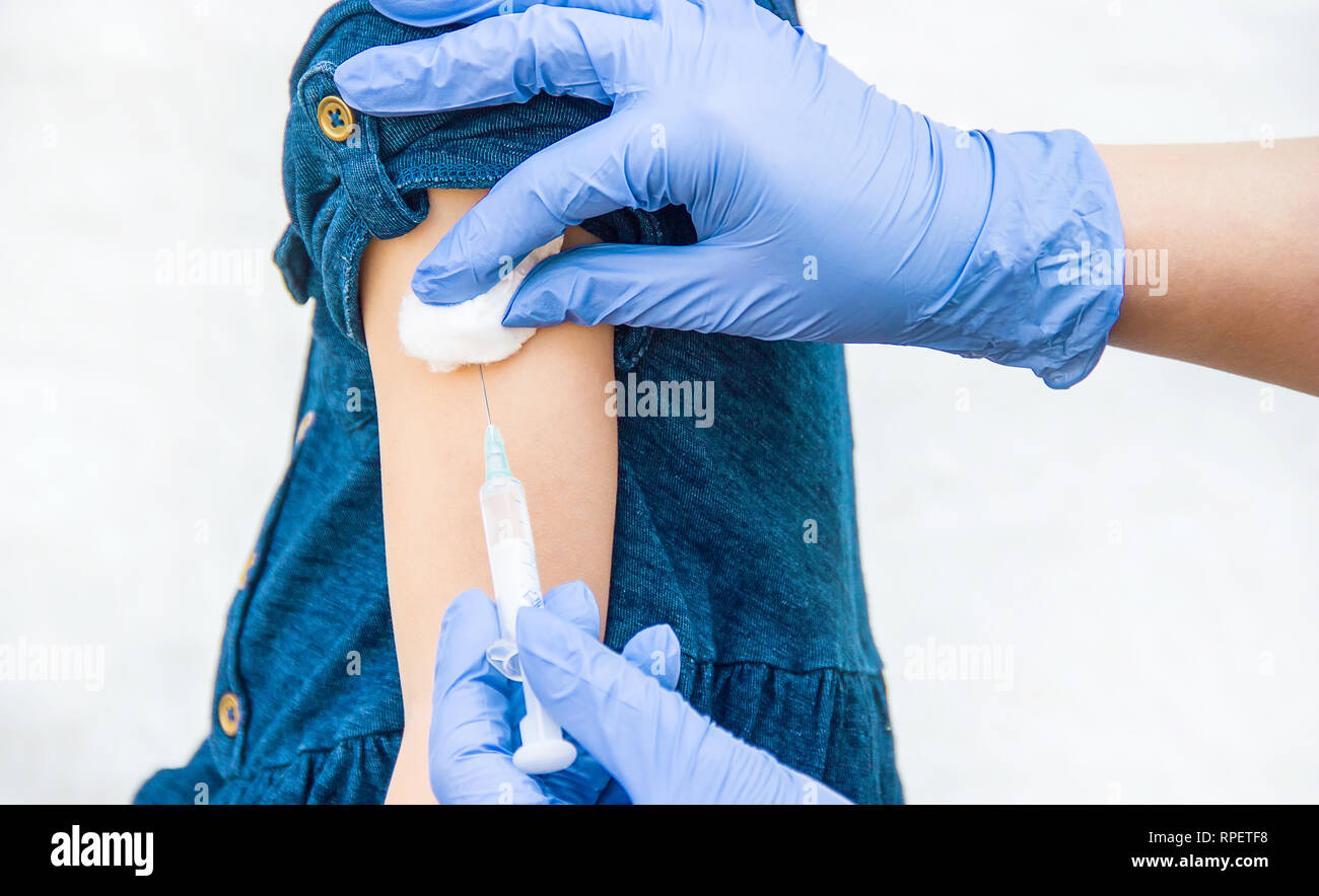 vaccination of children. An injection. Selective focus kids Stock Photo ...