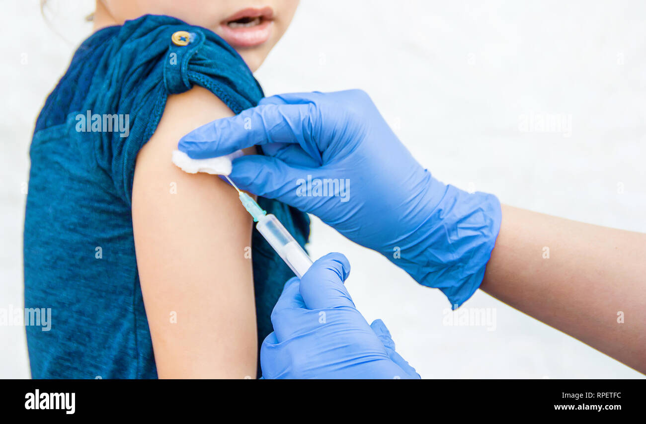 vaccination of children. An injection. Selective focus kids Stock Photo ...