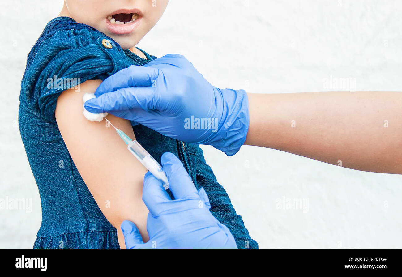 vaccination of children. An injection. Selective focus kids Stock Photo ...