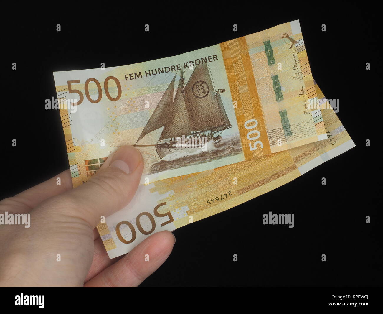500 note with hand hi-res stock photography and images - Alamy
