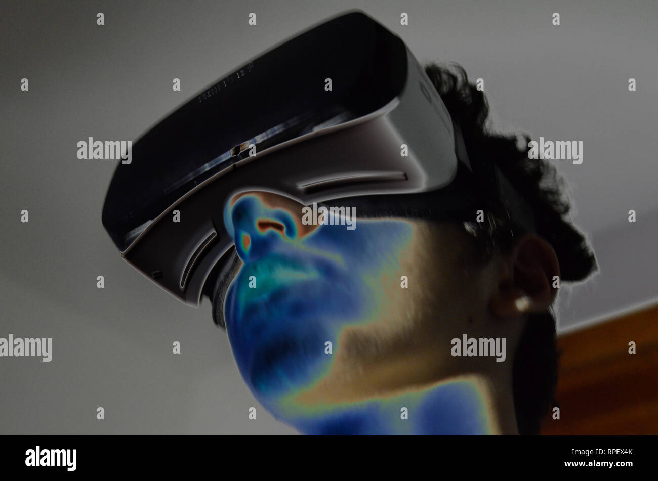 Abstract and conceptual image of a Caucasian boy wearing a VR 360 ...