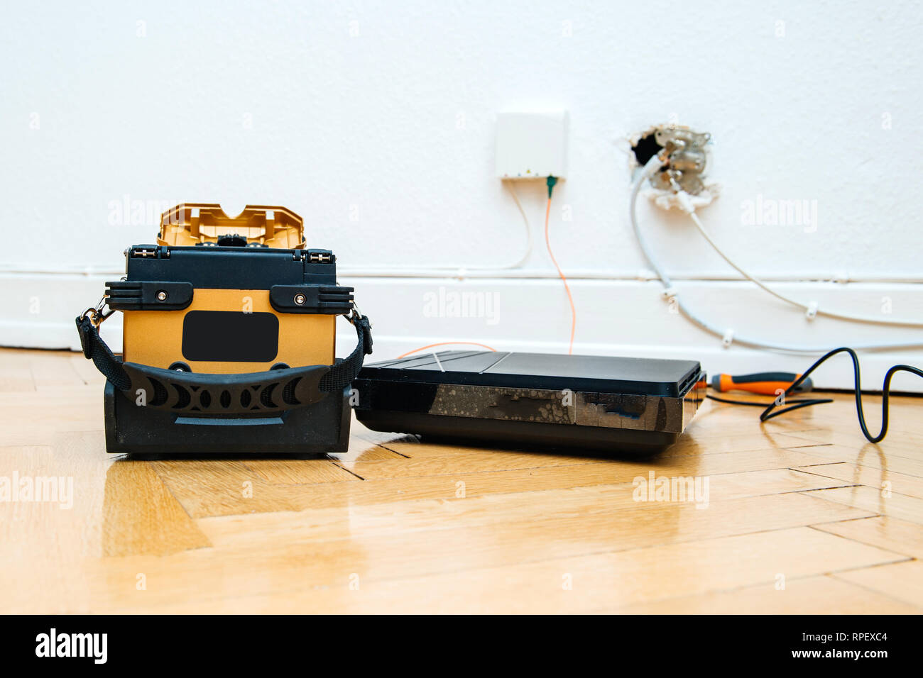 Modern FTTH fiber installation at home with new arc clad-alignment ...