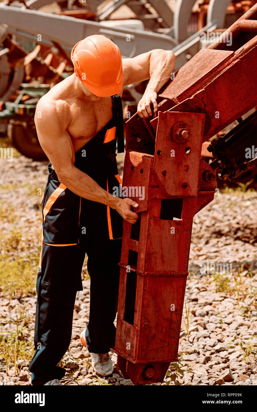 Repairman concept. Skillful repairman at work. Repairman fix heavy ...