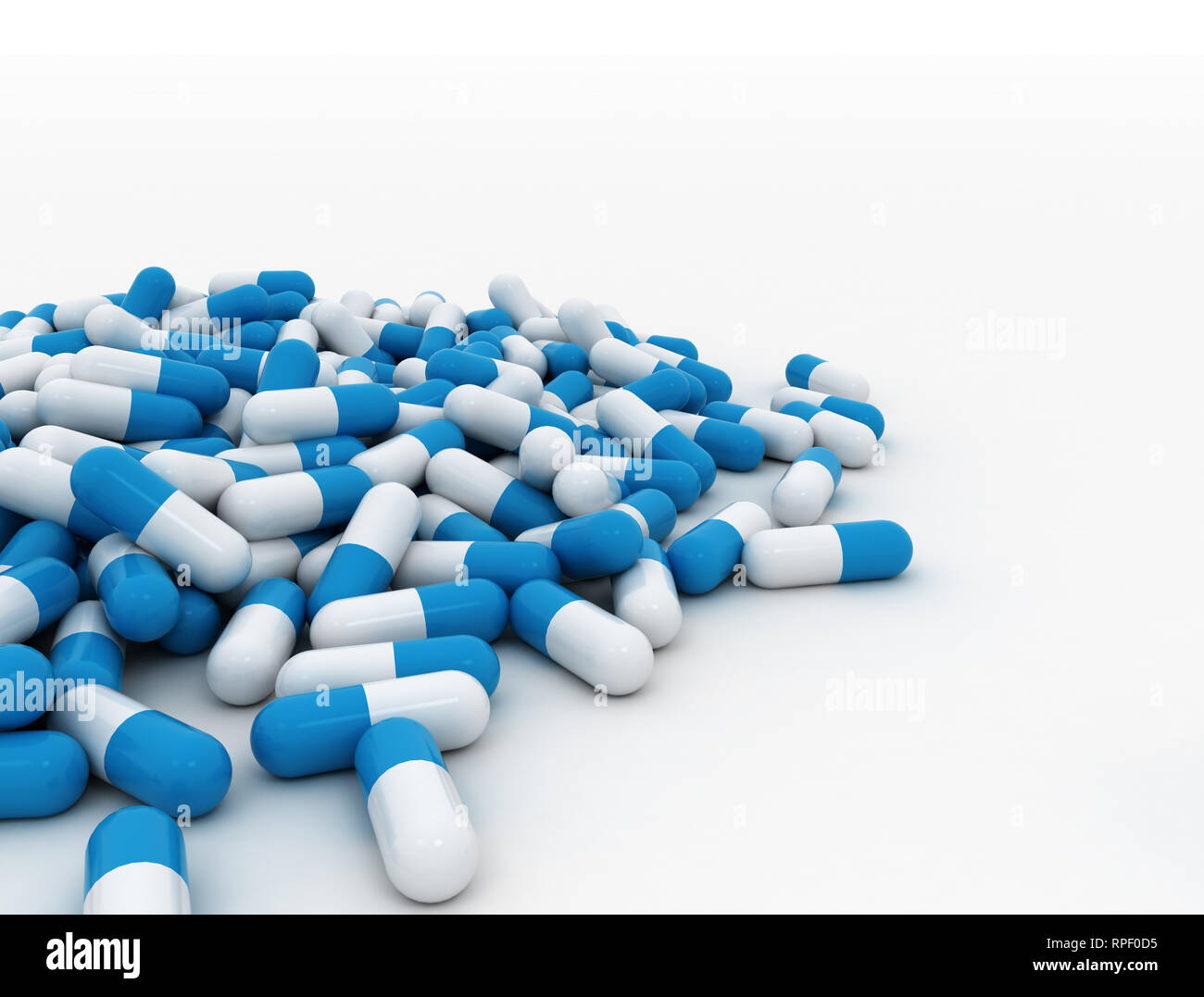 Drug prescription medication. Heap of white and blue capsule pills on ...