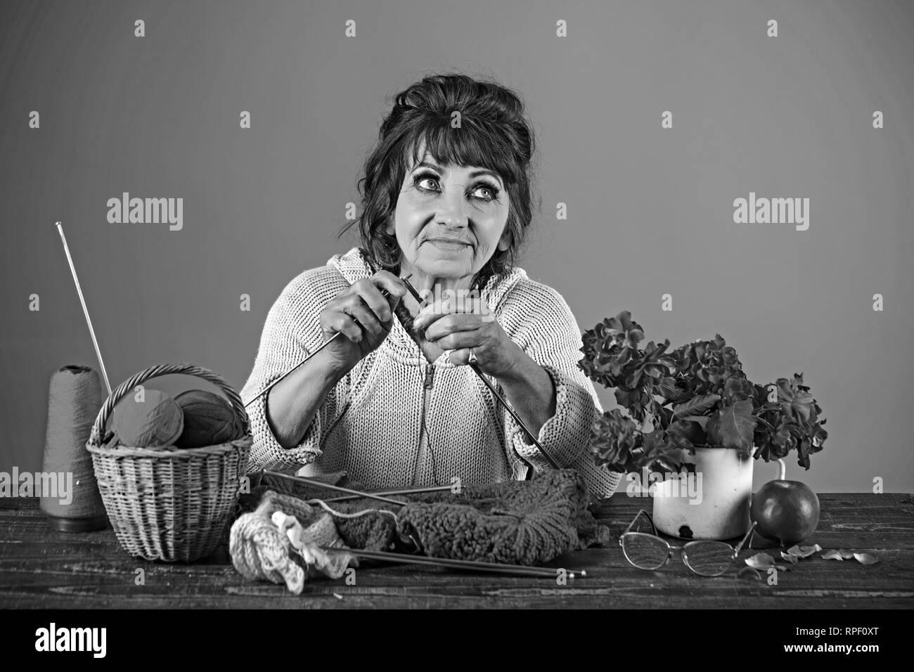 Old lady or grandmother with needle and yarn Stock Photo - Alamy