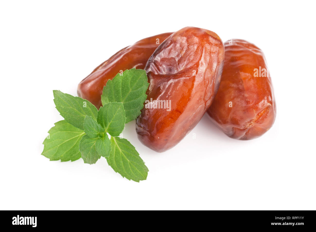 three dates with mint leaves isolated on white background Stock Photo ...