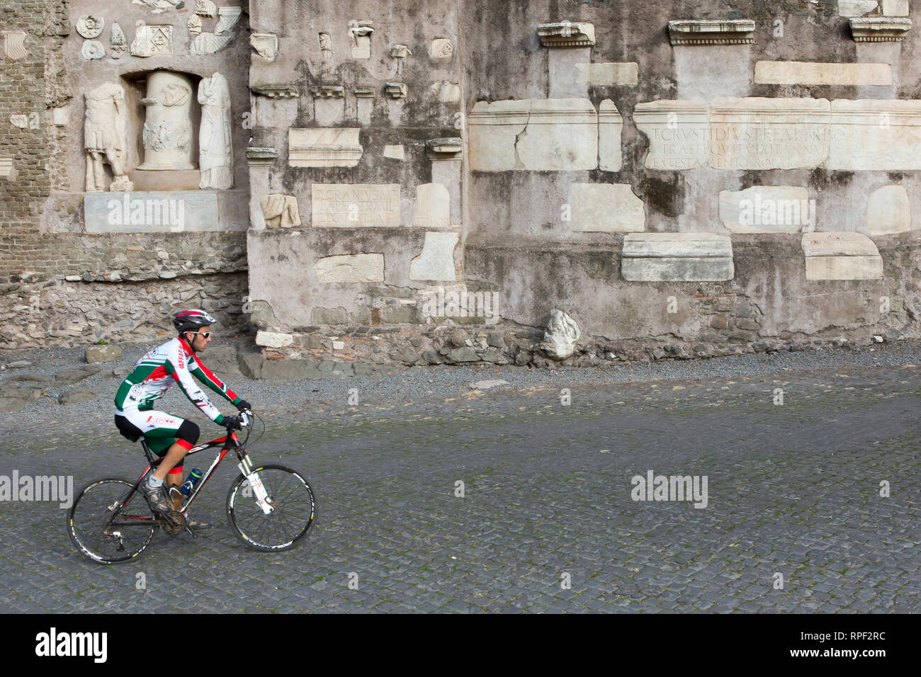 ROME - A cyclist at the site of the tomb of Caecilia Metella on the ...