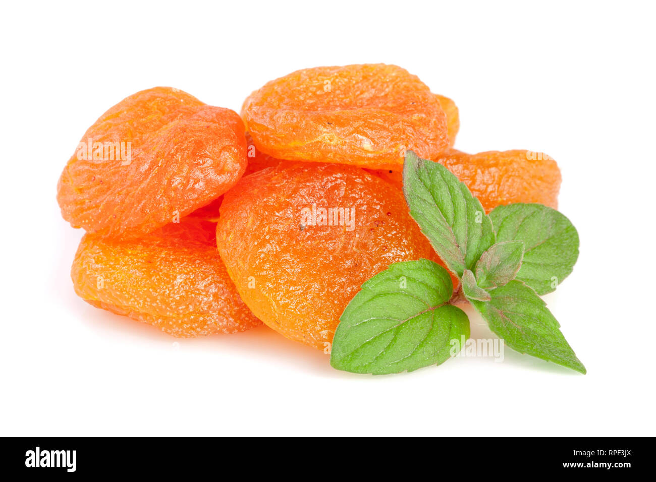 Dried apricots with mint leaves isolated on white background Stock ...