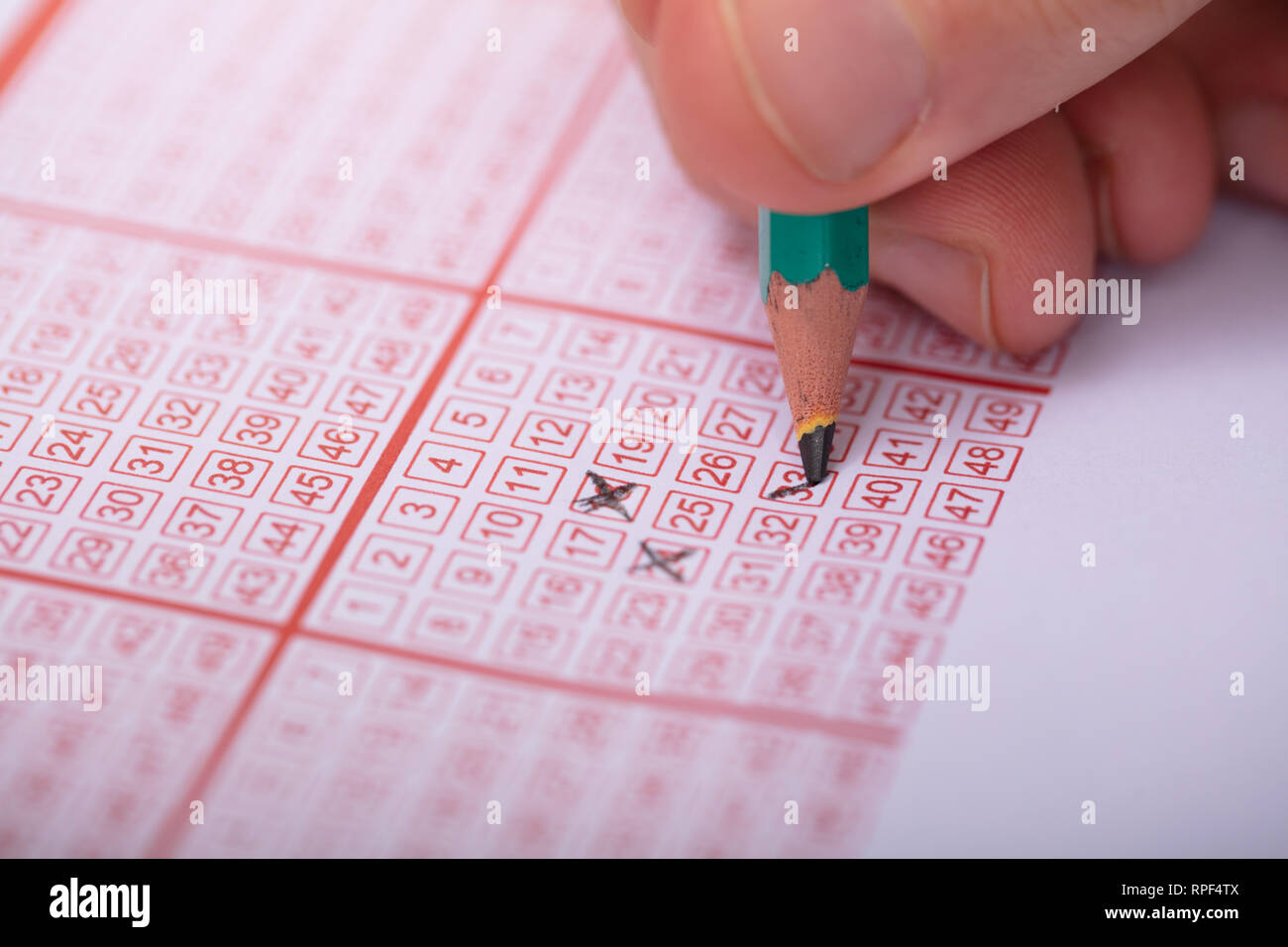 Close-up Of A Person Marking Number On Lottery Ticket With Pencil Stock ...
