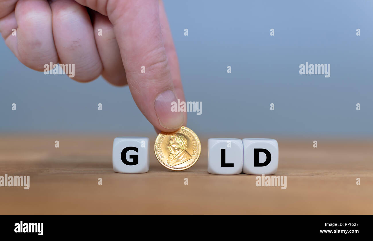 Dice and a Krugerrand coin form the word "GOLD Stock Photo - Alamy