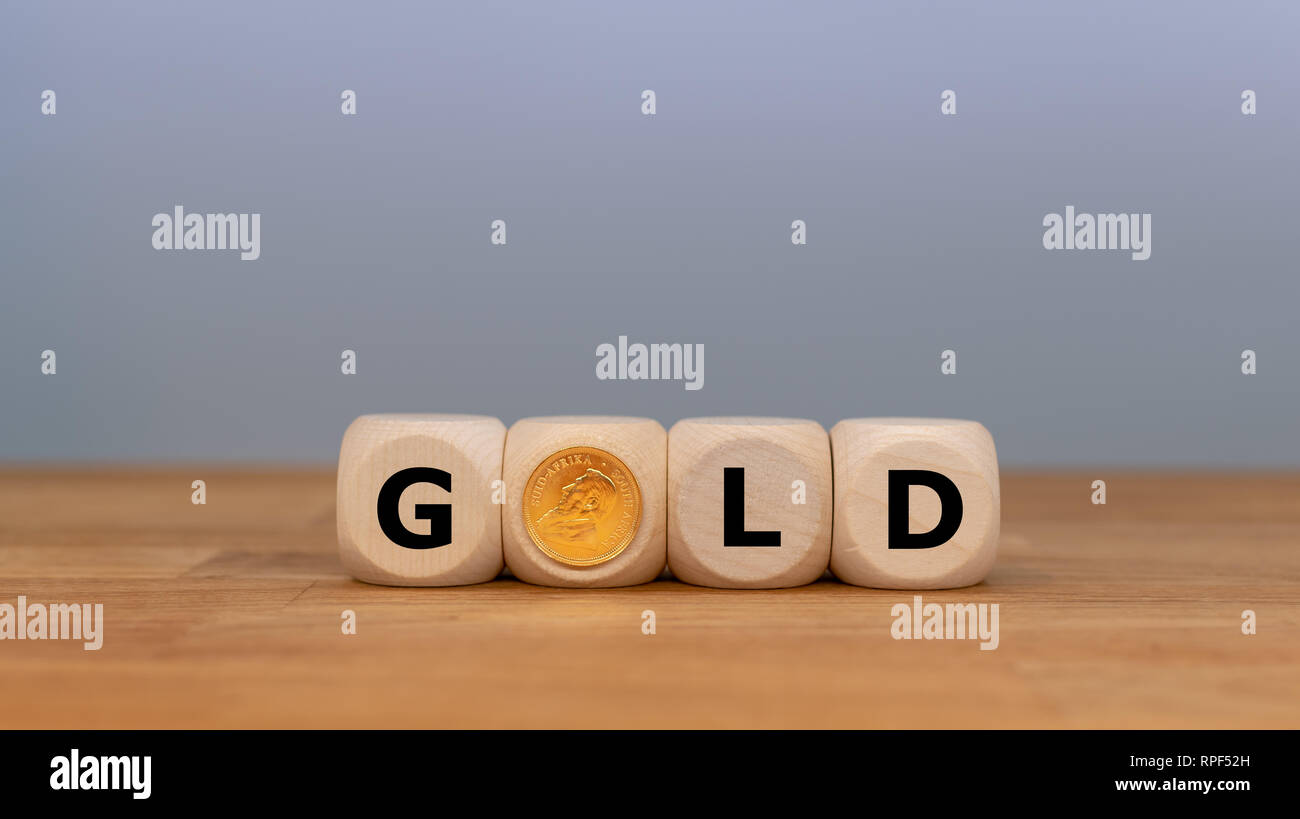 Dice and a Krugerrand coin form the word "GOLD Stock Photo - Alamy