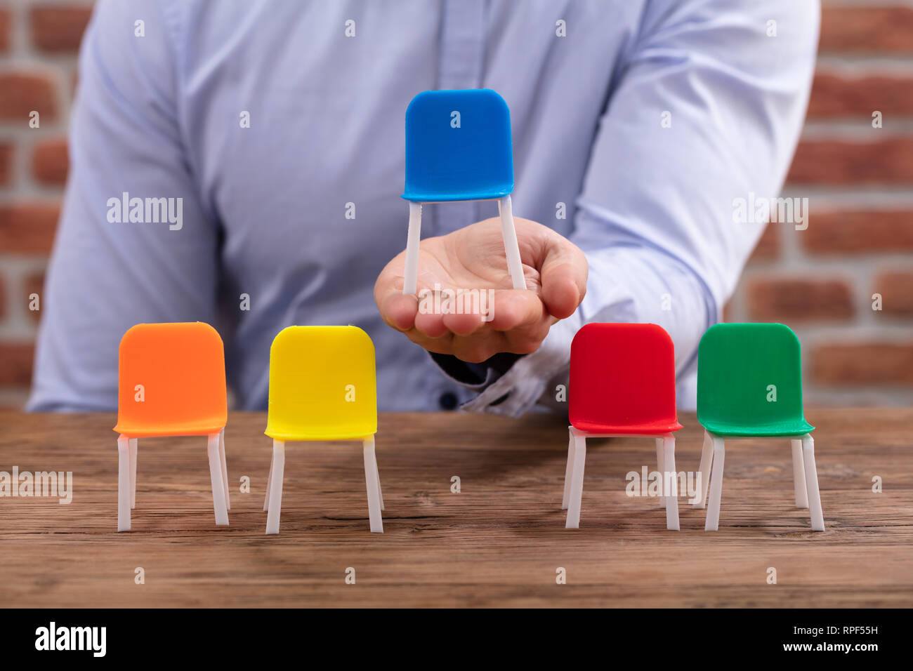 Holding on chairs hi-res stock photography and images - Alamy