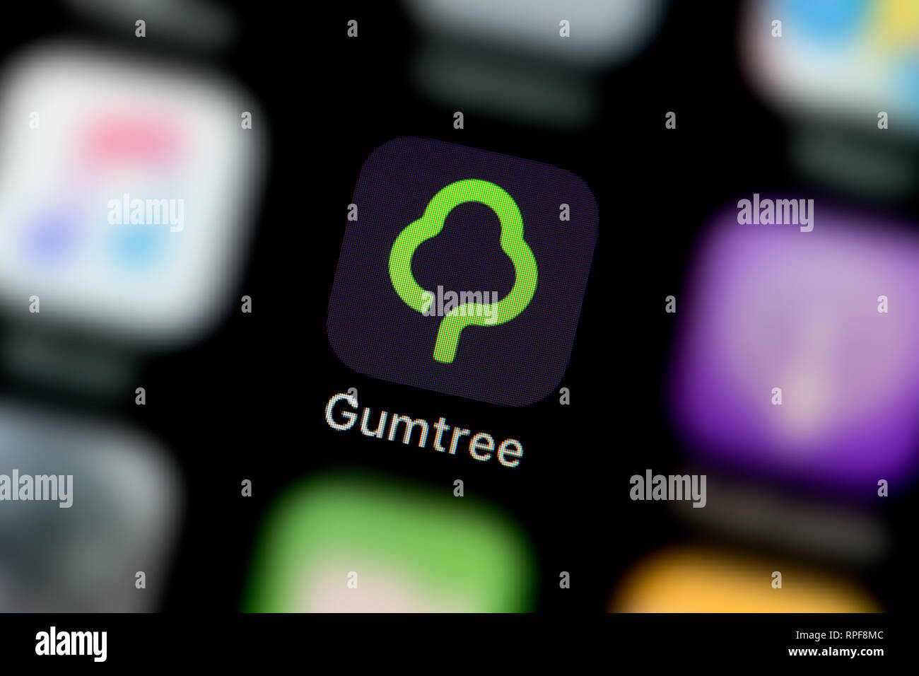 A close-up shot of the Gumtree app icon, as seen on the screen of a ...