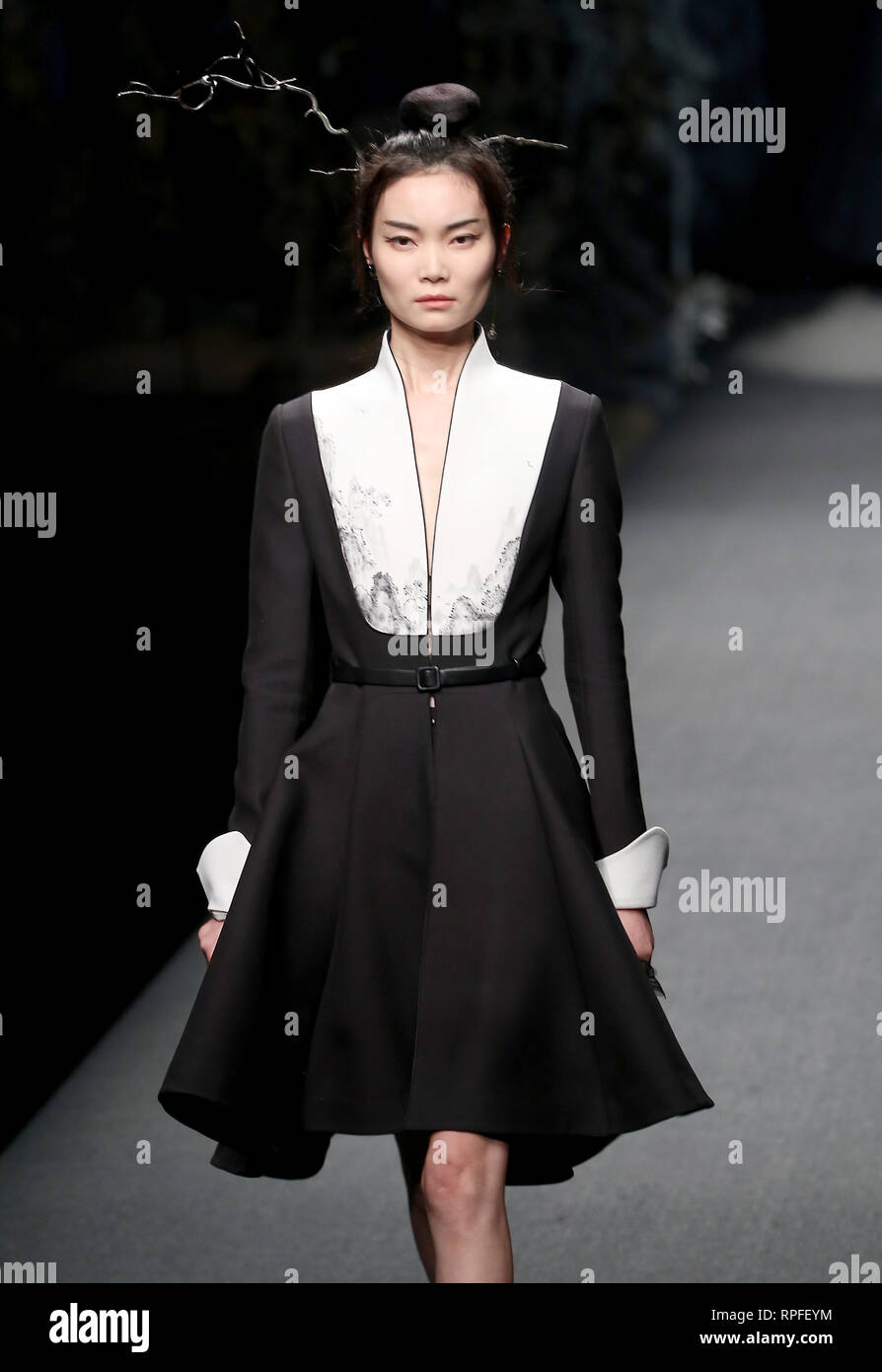 Beijing, China. 1st Apr, 2018. Models wear clothing by designer Xiong ...