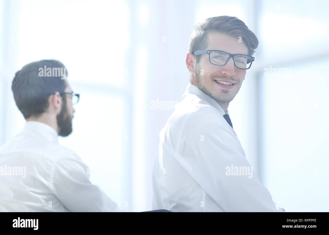 rear view.employees in the workplace Stock Photo - Alamy