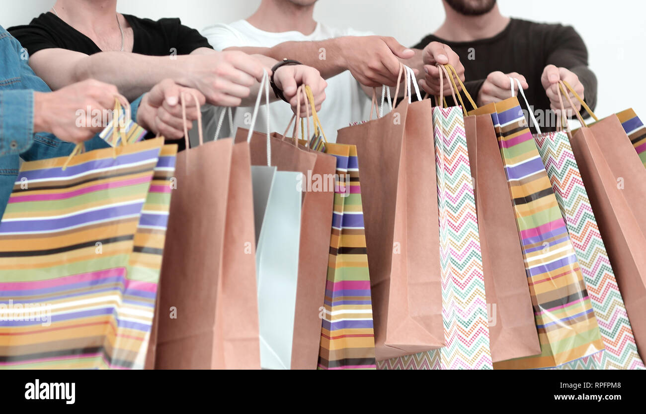 paper bags in the hands of a team of friends Stock Photo - Alamy