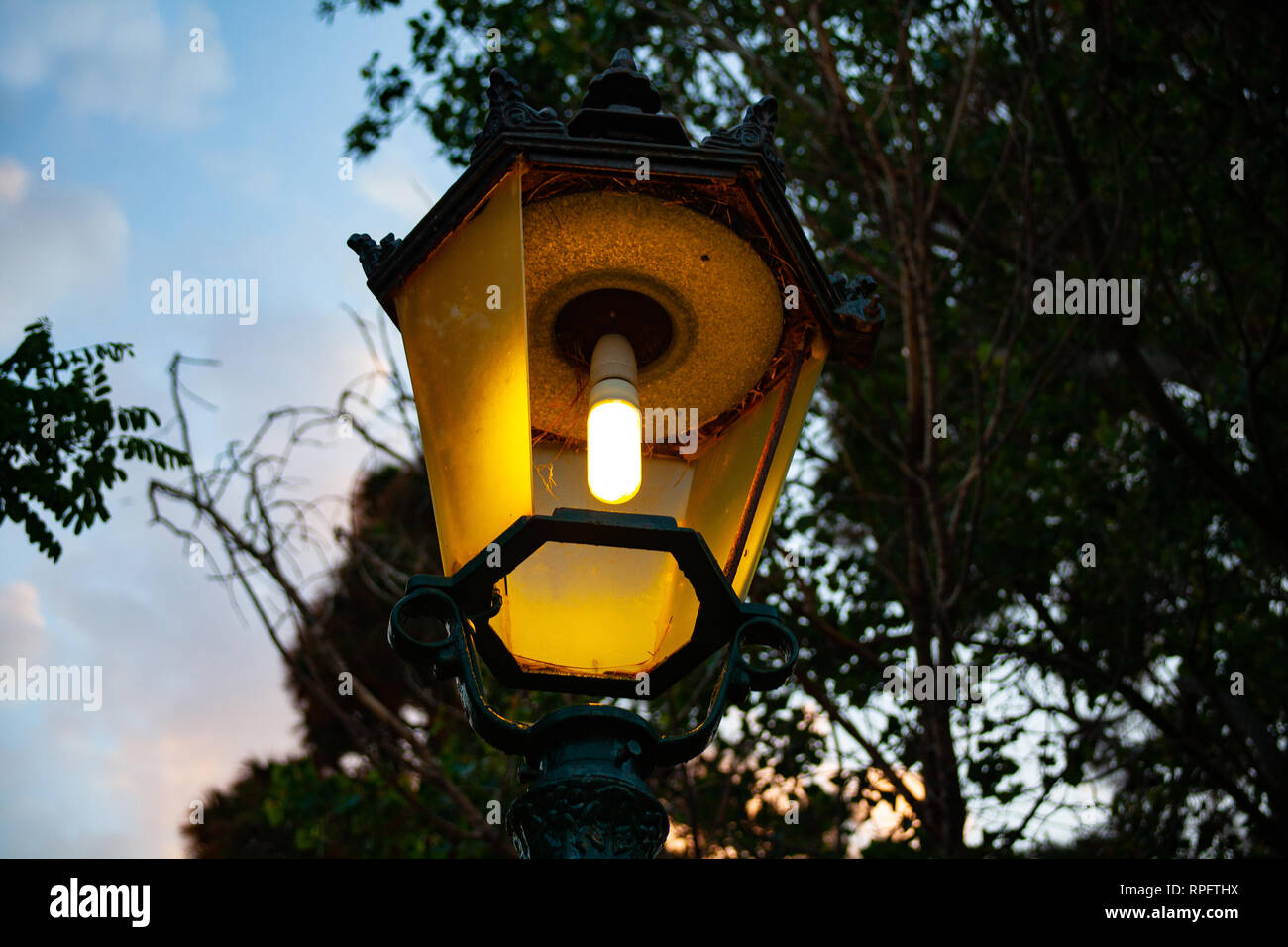 Street lighting at night with white bulb. Old retro street lighting ...