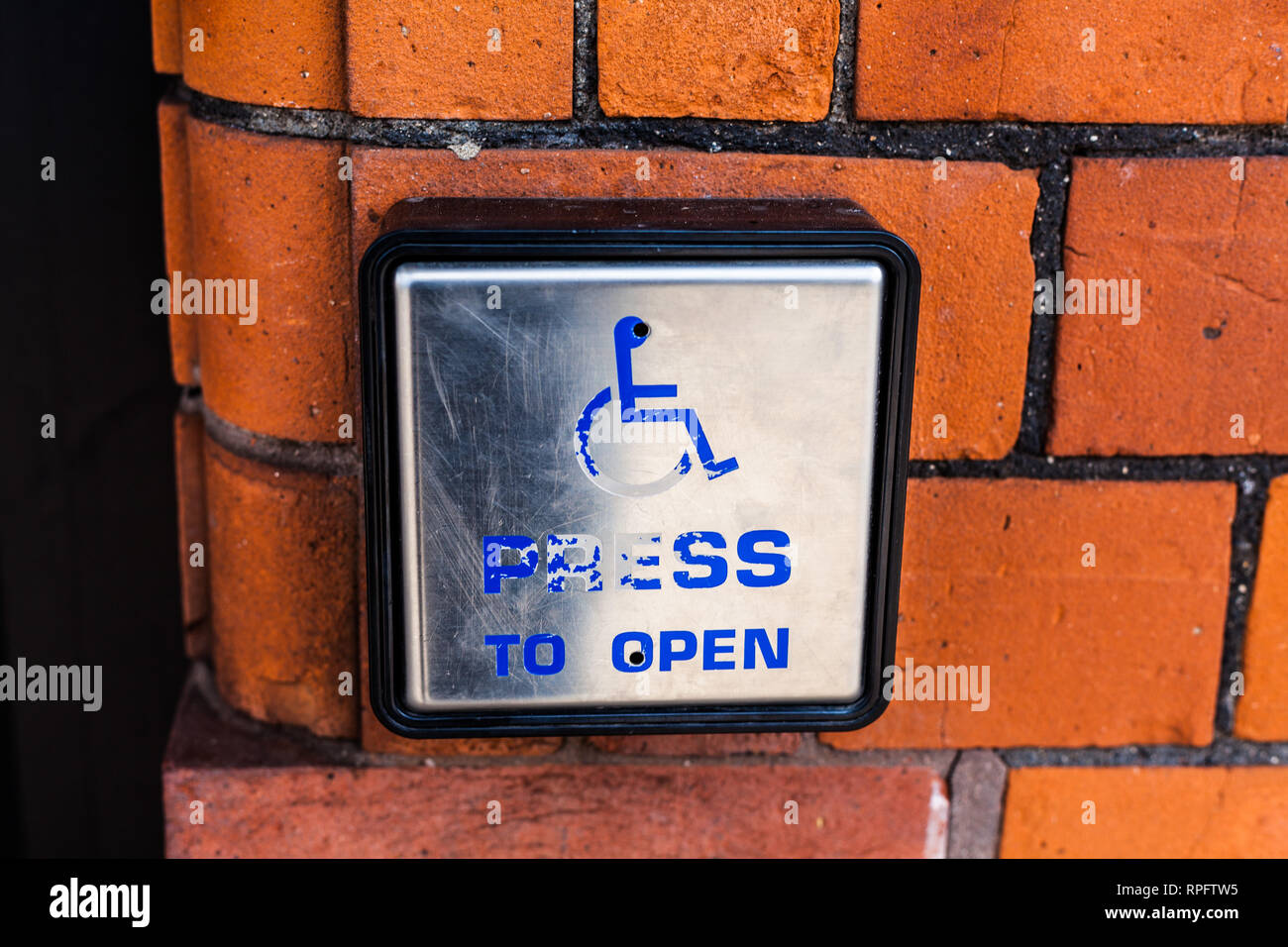 Assistance button for disabled people on the building entrance ...