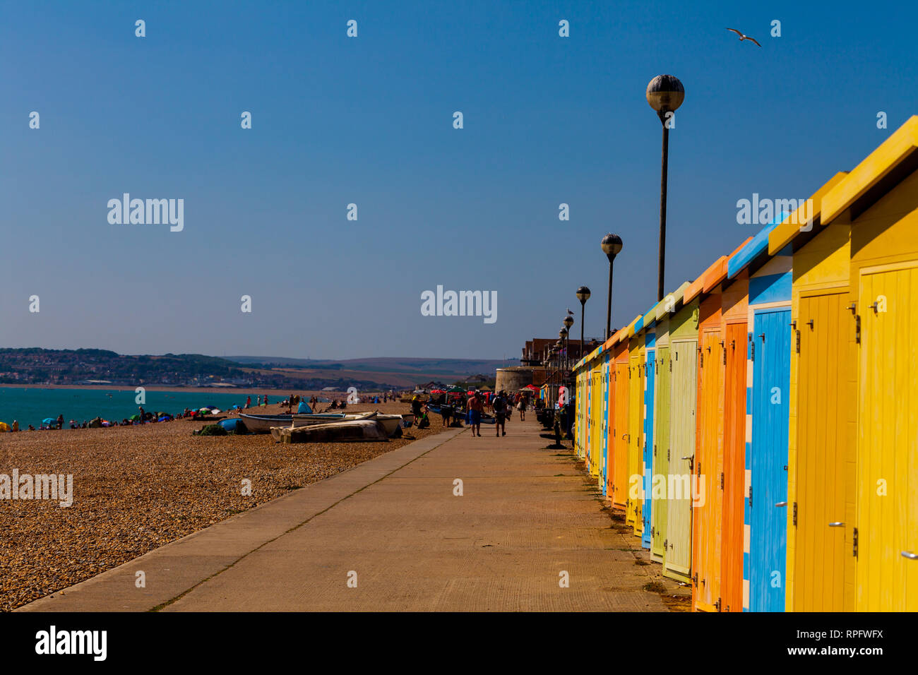 Wooden public change rooms on the beach. Colorful change rooms. Holiday ...