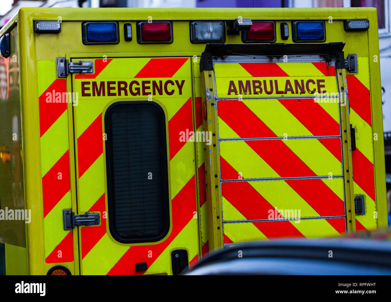 Back view of ambulance car in the traffic. Urgent help and health ...