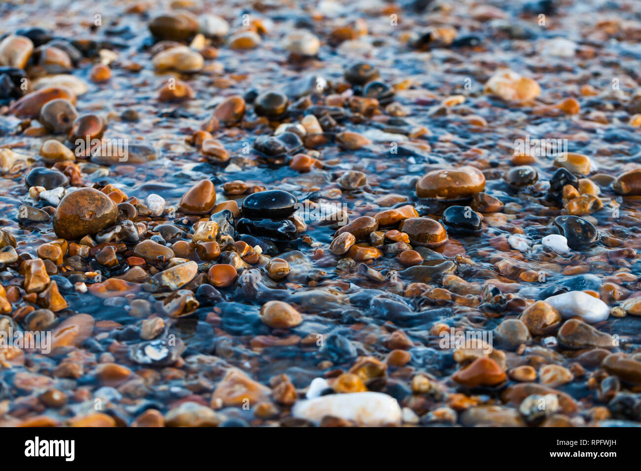 Shallow water on the beach with rocks. Calm and health concept with ...
