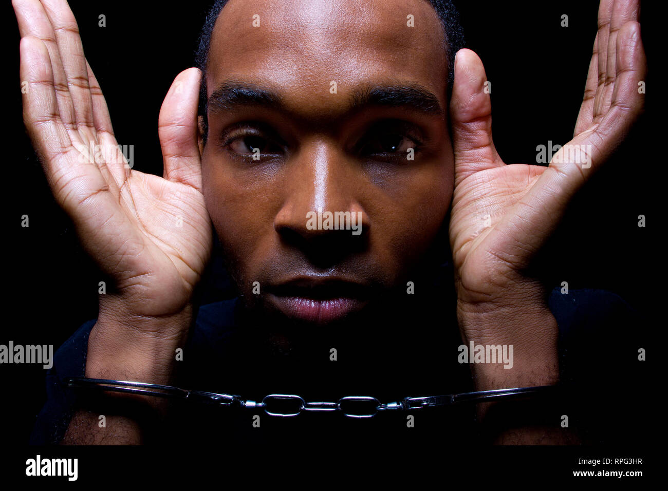 Inmate cuffed jail hi-res stock photography and images - Alamy