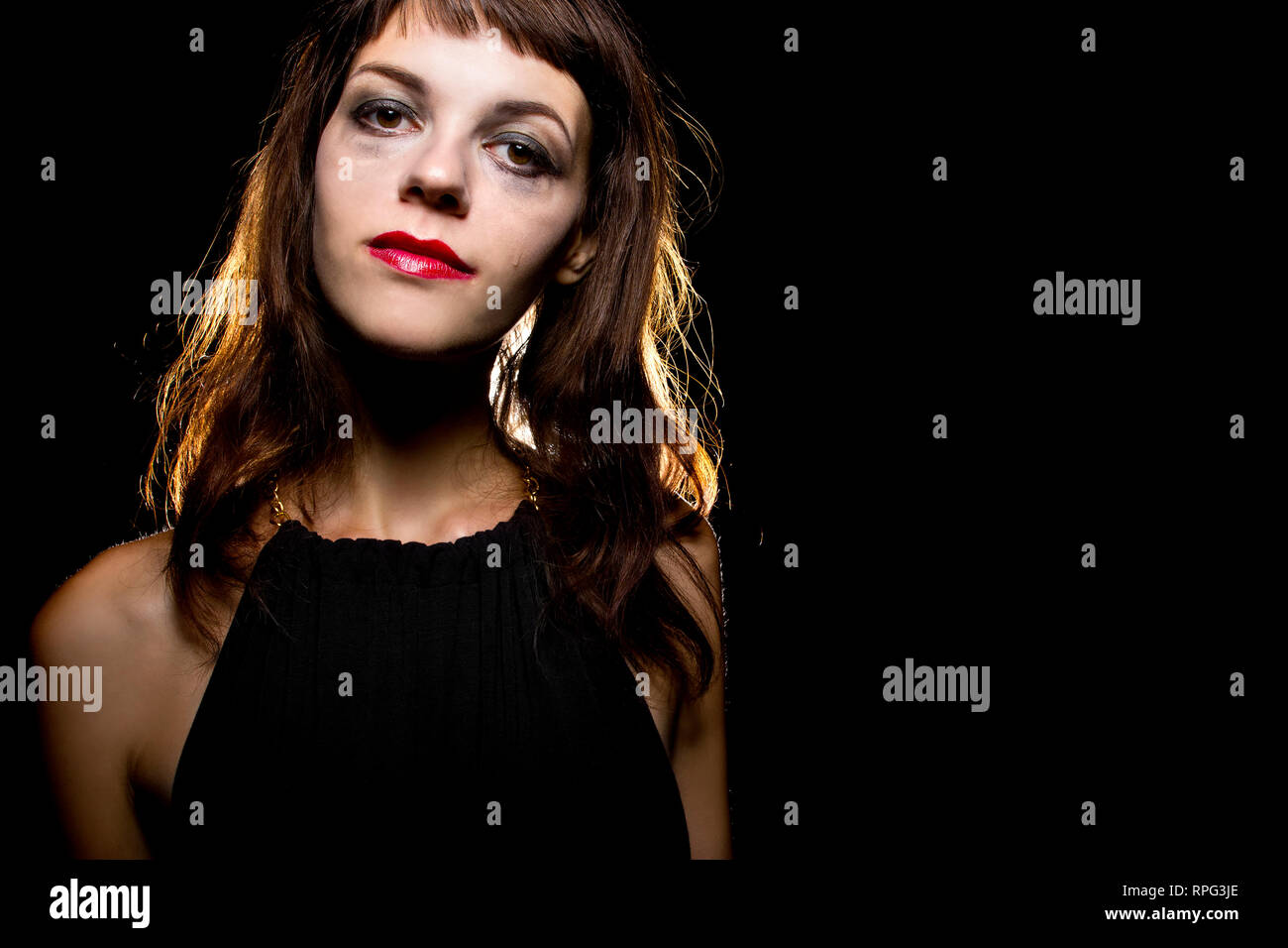 smeared make-up by crying tears on a noir style sad woman Stock Photo ...