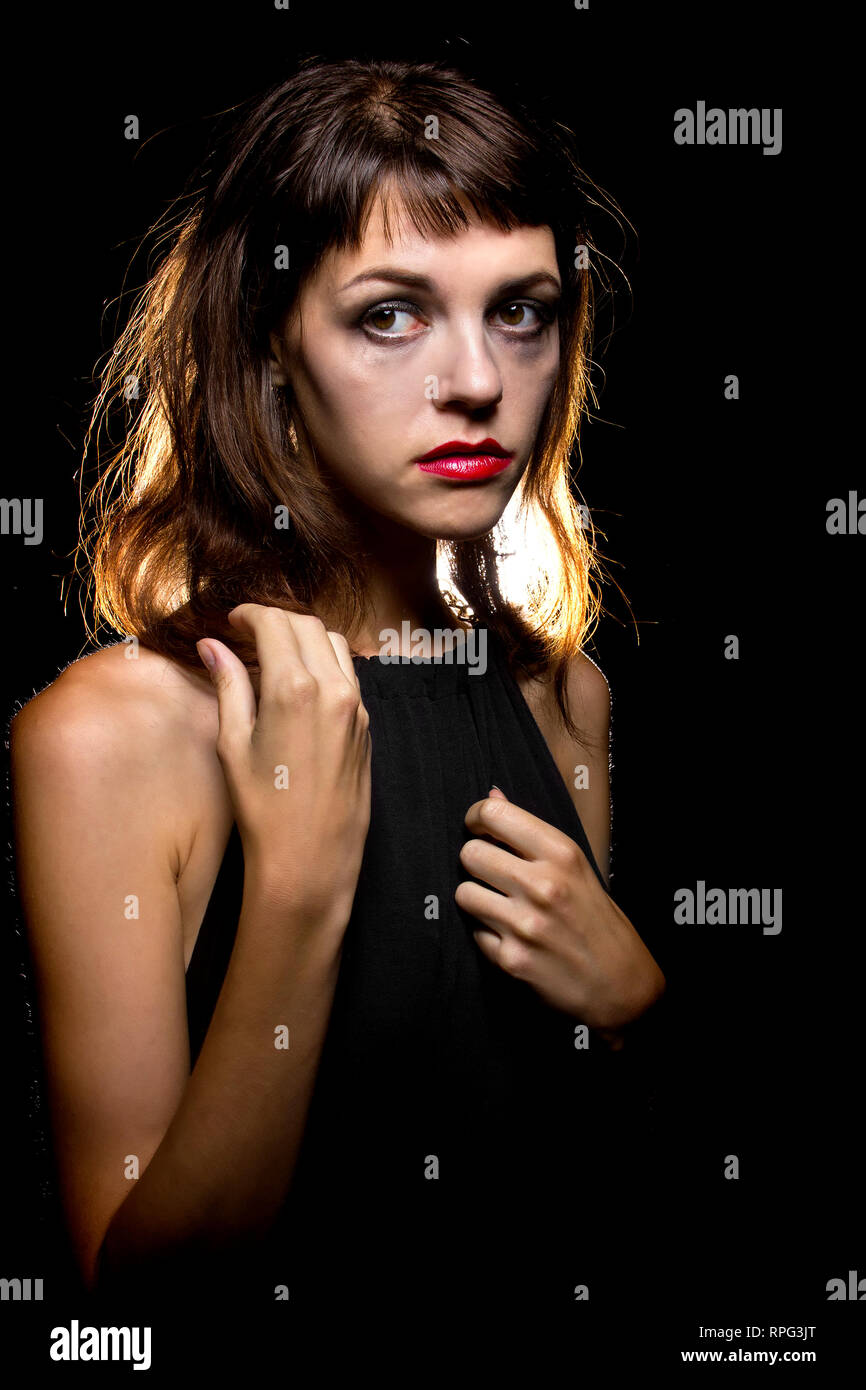 smeared make-up by crying tears on a noir style sad woman Stock Photo ...