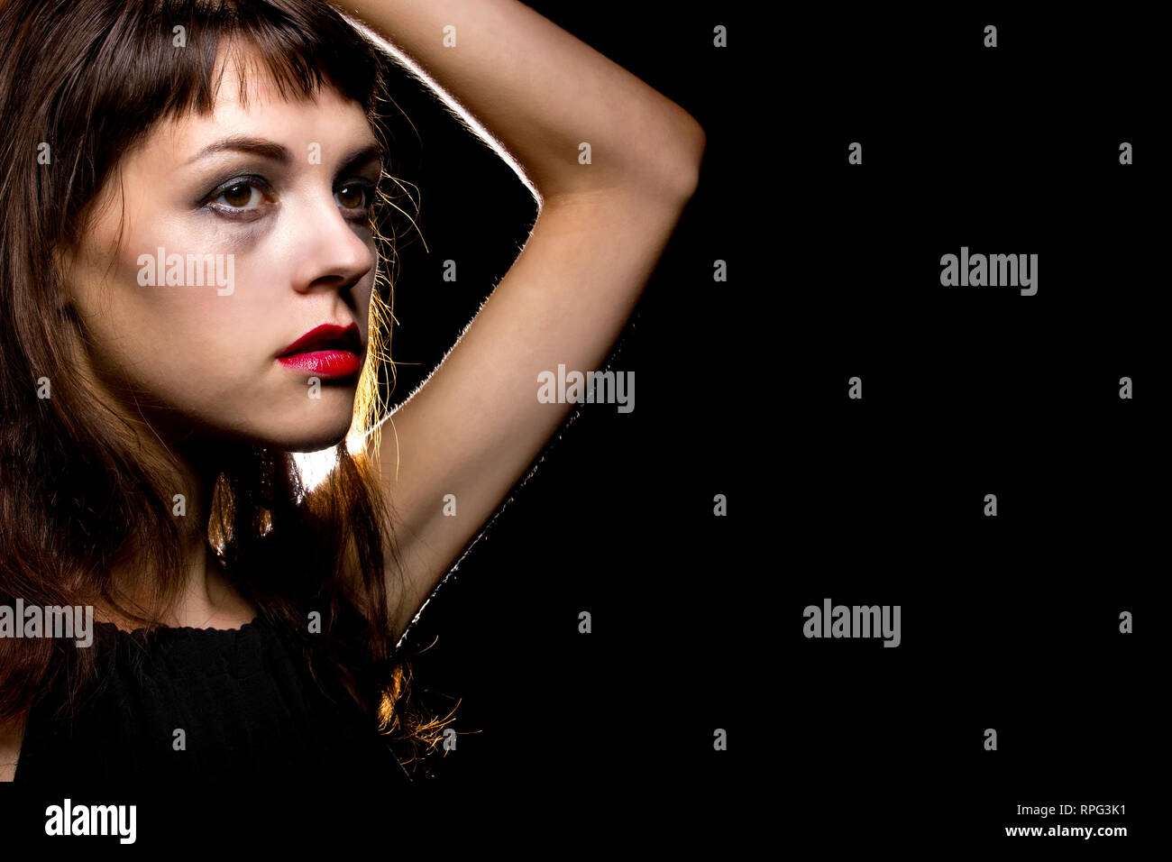 smeared make-up by crying tears on a noir style sad woman Stock Photo ...